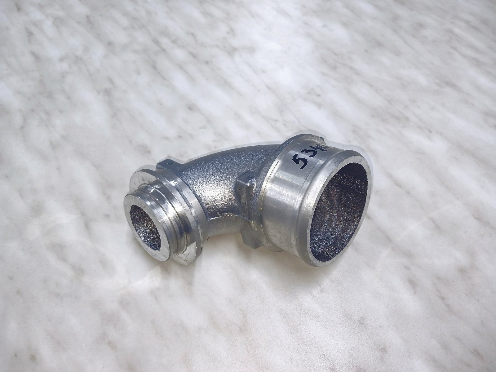 Патрубок отводящий турбокомпрессора дв.534 ЯМЗ