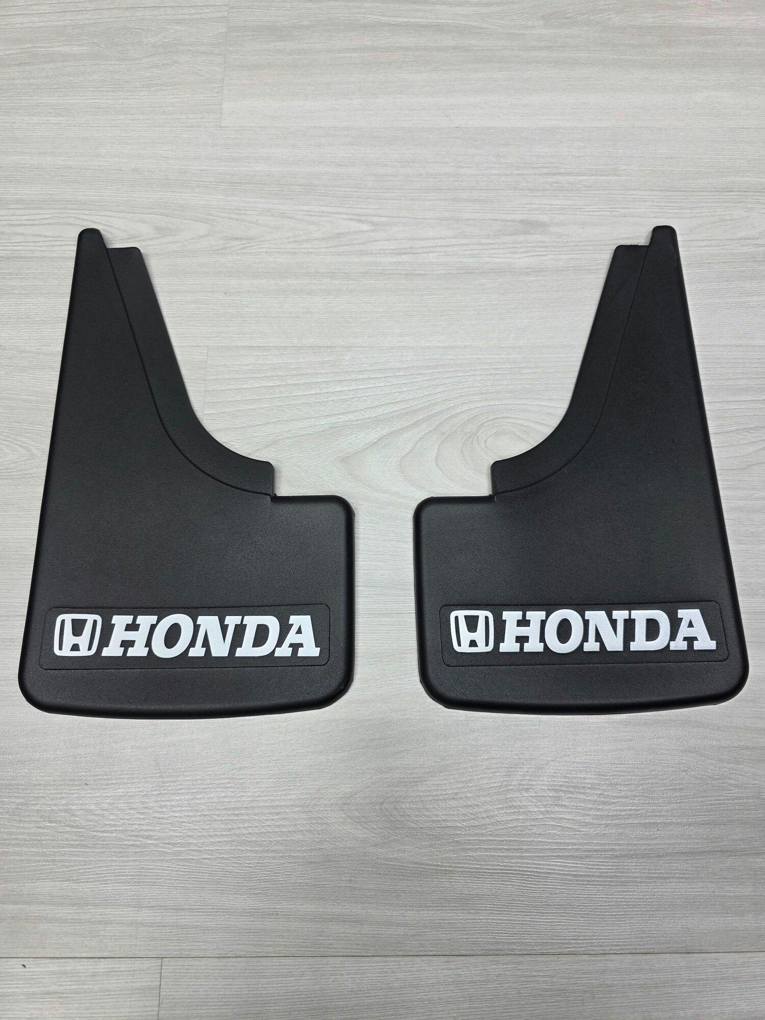 Брызговики передние на Honda Fit 2002-2008 (Хонда)