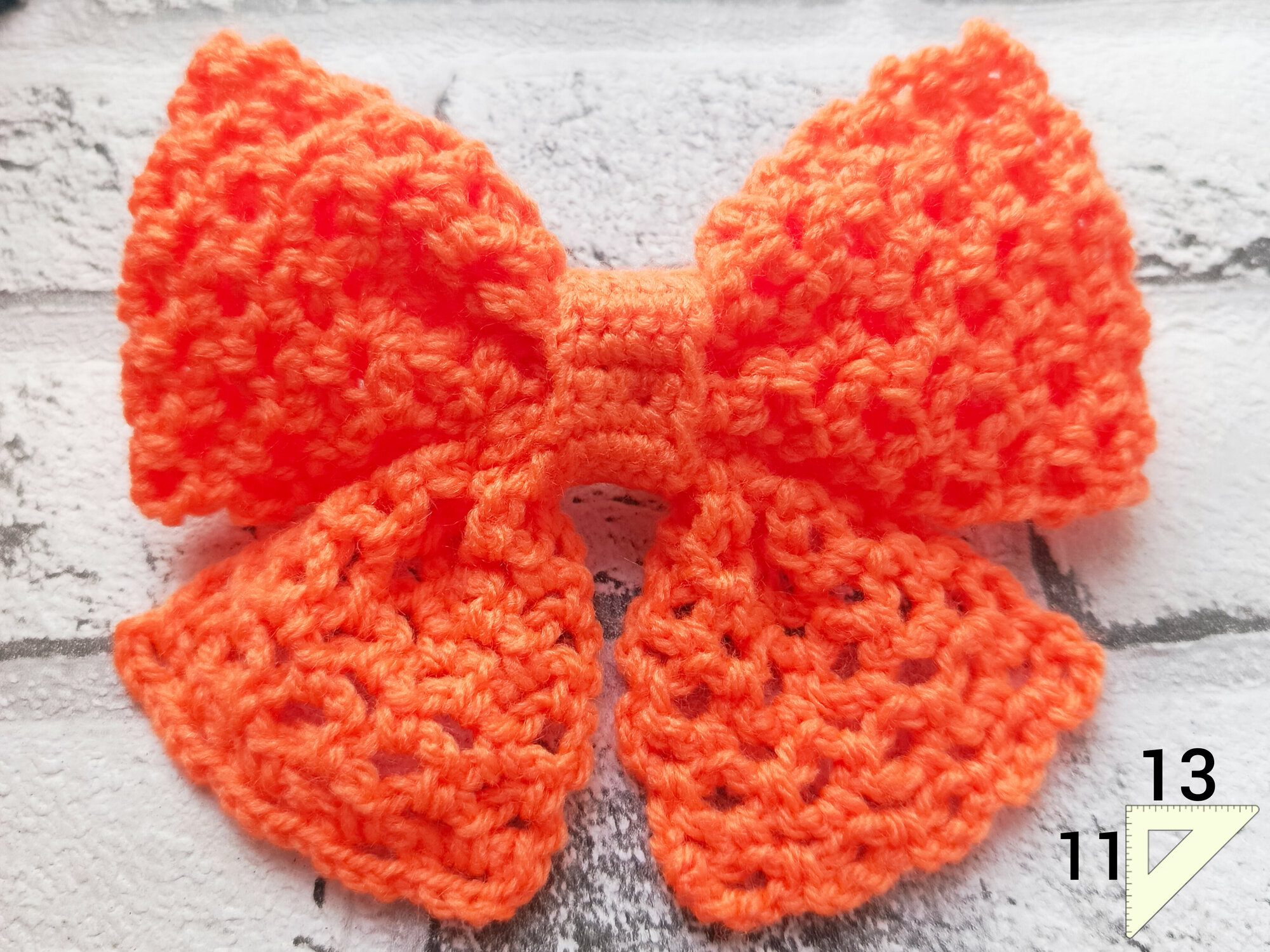 Бант вязаный на резинке, оранжевый .