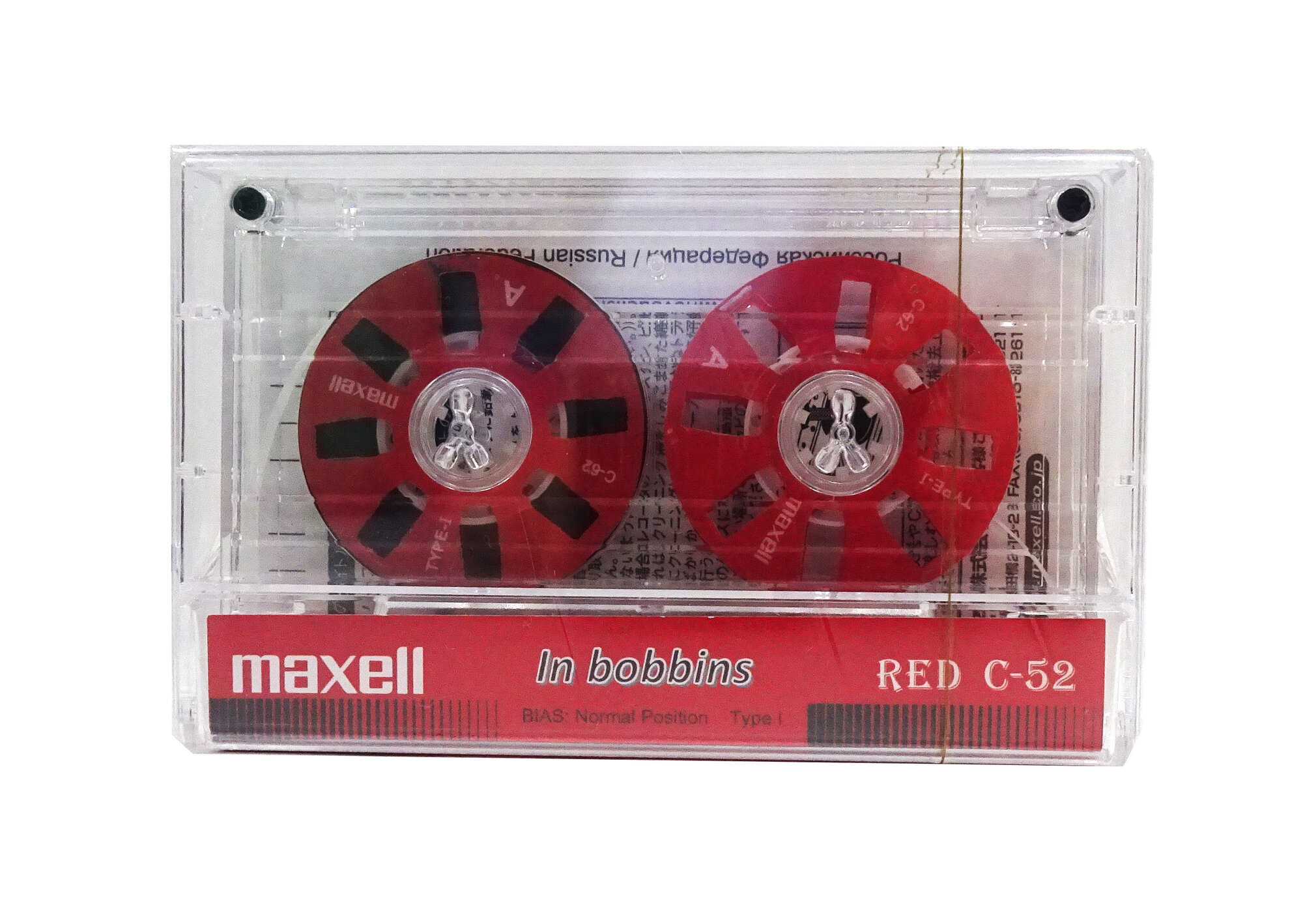 Аудиокассета Maxell с красными катушками и 8 отверстий