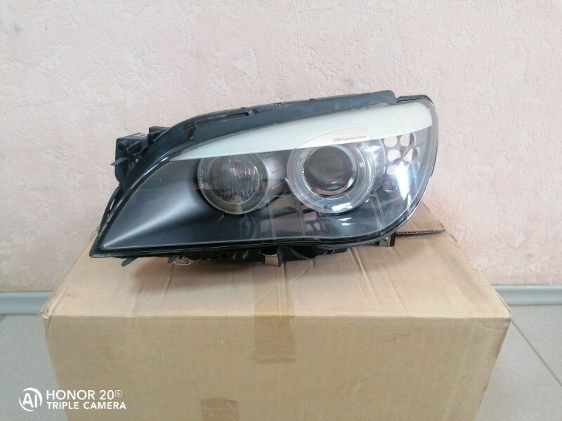 Фара BMW 7 2008 Лев.