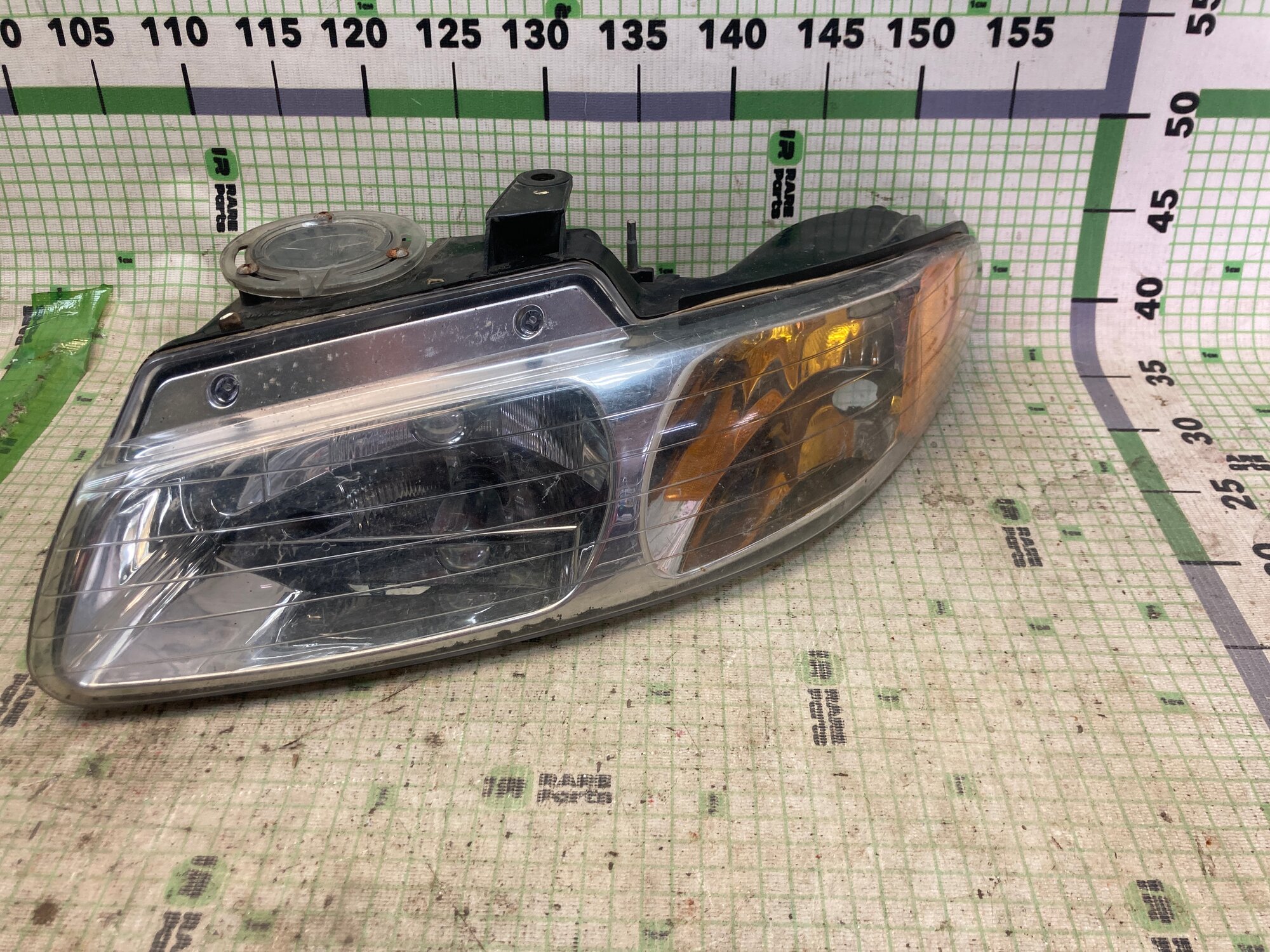 Фара левая Chrysler Voyager, Dodge Caravan