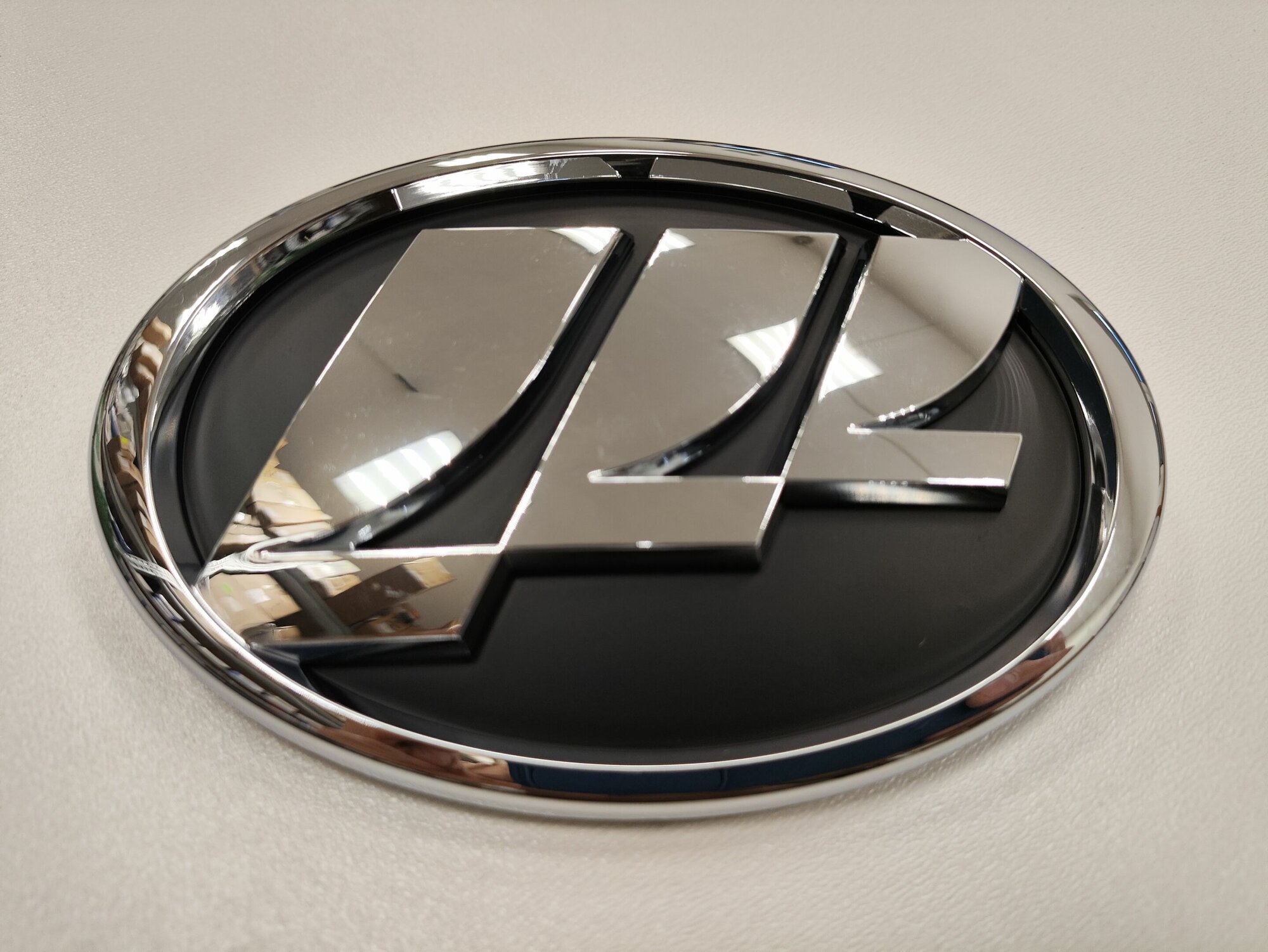 Эмблема решетки радиатора Lifan Smily NEW (330) [1.3 16V 5MT хетчбэк]