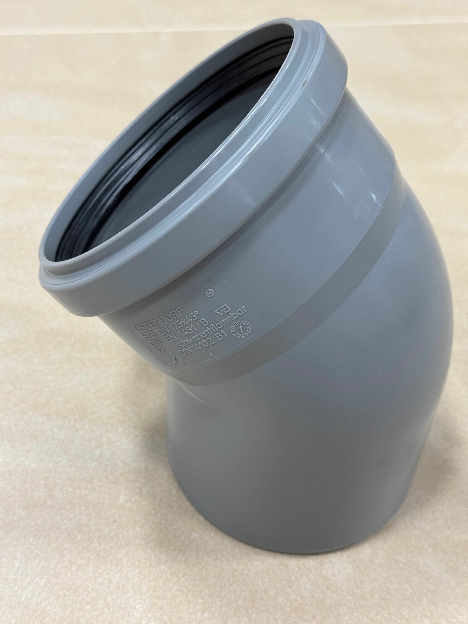 Отвод 125х45гр. Ostendorf серый