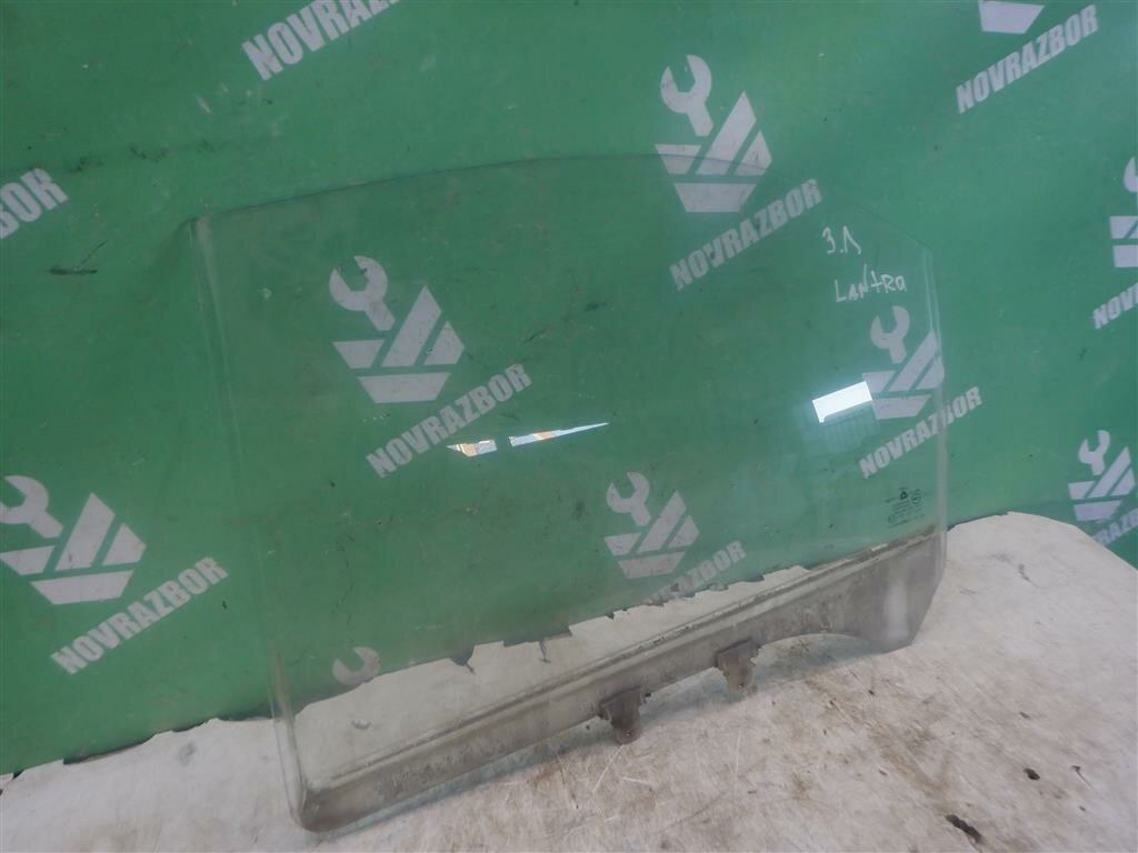 Стекло двери задней левой Hyundai Lantra 96-00