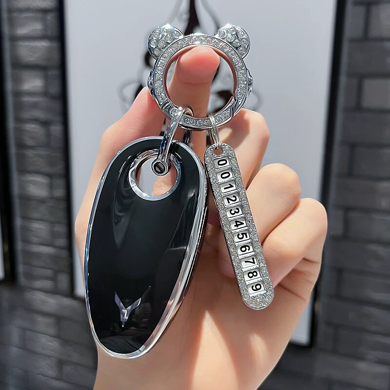 Чехол для ключа Voyah Dream L с черной оболочкой, замком в виде космонавта и табличкой с номером