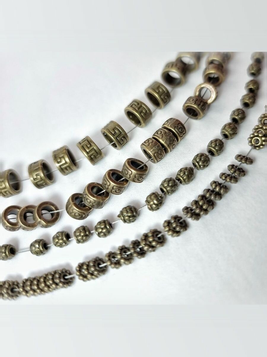 Бусины металлические 4-8мм. 130шт. Цвет бронза.