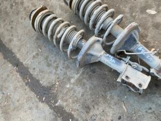 Стойка амортизатора Kia Spectra 1 поколение [2-Й рестайлинг] 1.6 S6D 2006 задн. лев. (б/у)