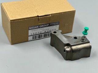 Натяжитель цепи грм Nissan 13070-AU000 оригинал