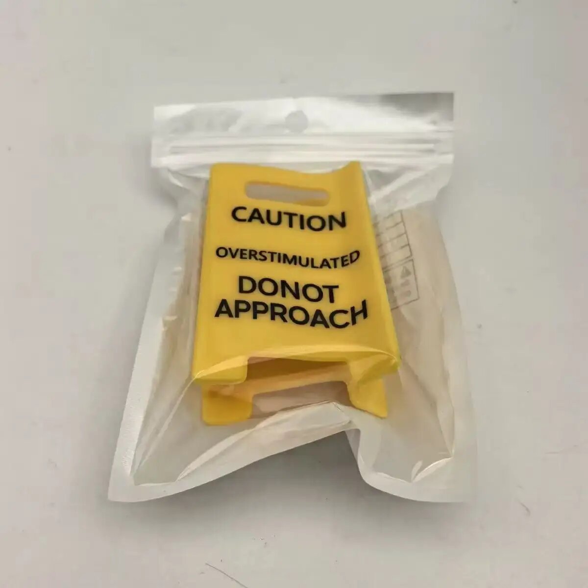 Желтая заколка для волос "Caution: Overstimulated"