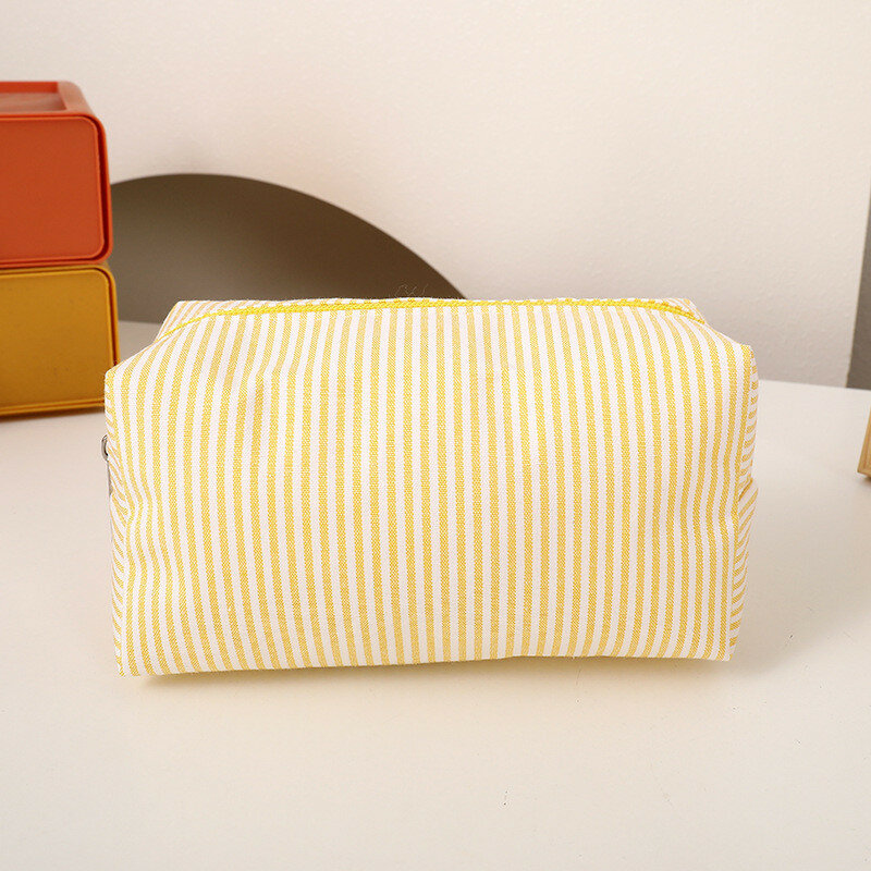 Small compact triangle stationery bag with patterned fabric for kids and teens yellow