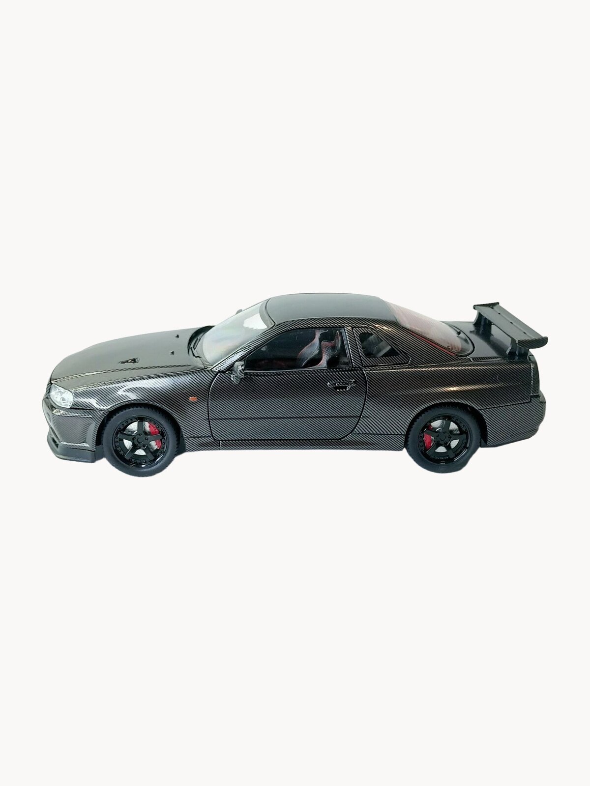 Модель автомобиля NISSAN Skyline GT-R R34 коллекционная металлическая игрушка масштаб 1:24 черный