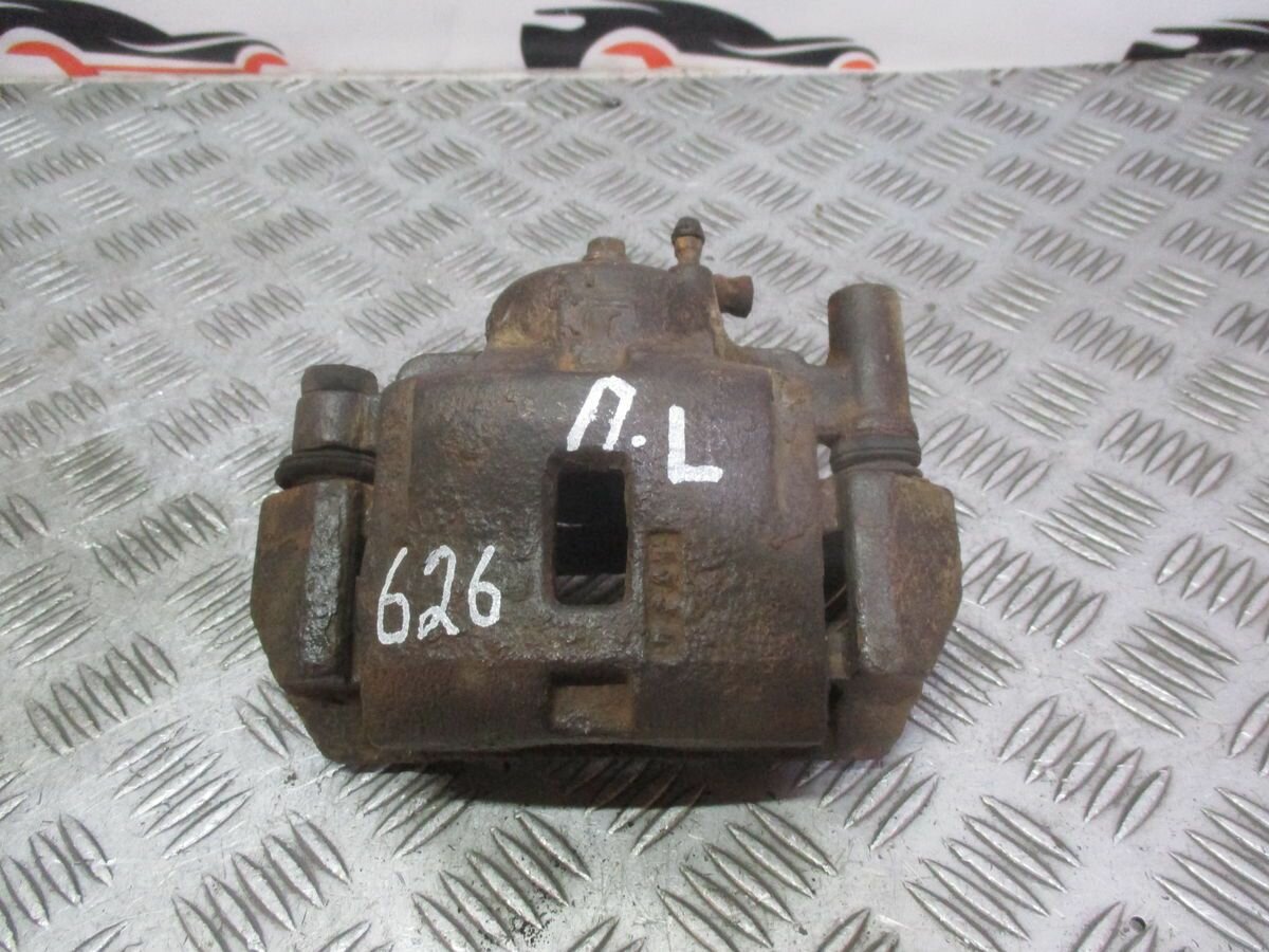 Суппорт тормозной передний Mazda 626 GF 1997-2002