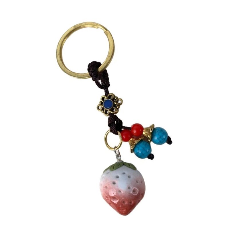 Плетеный брелок с клубничной подвеской в этническом стиле