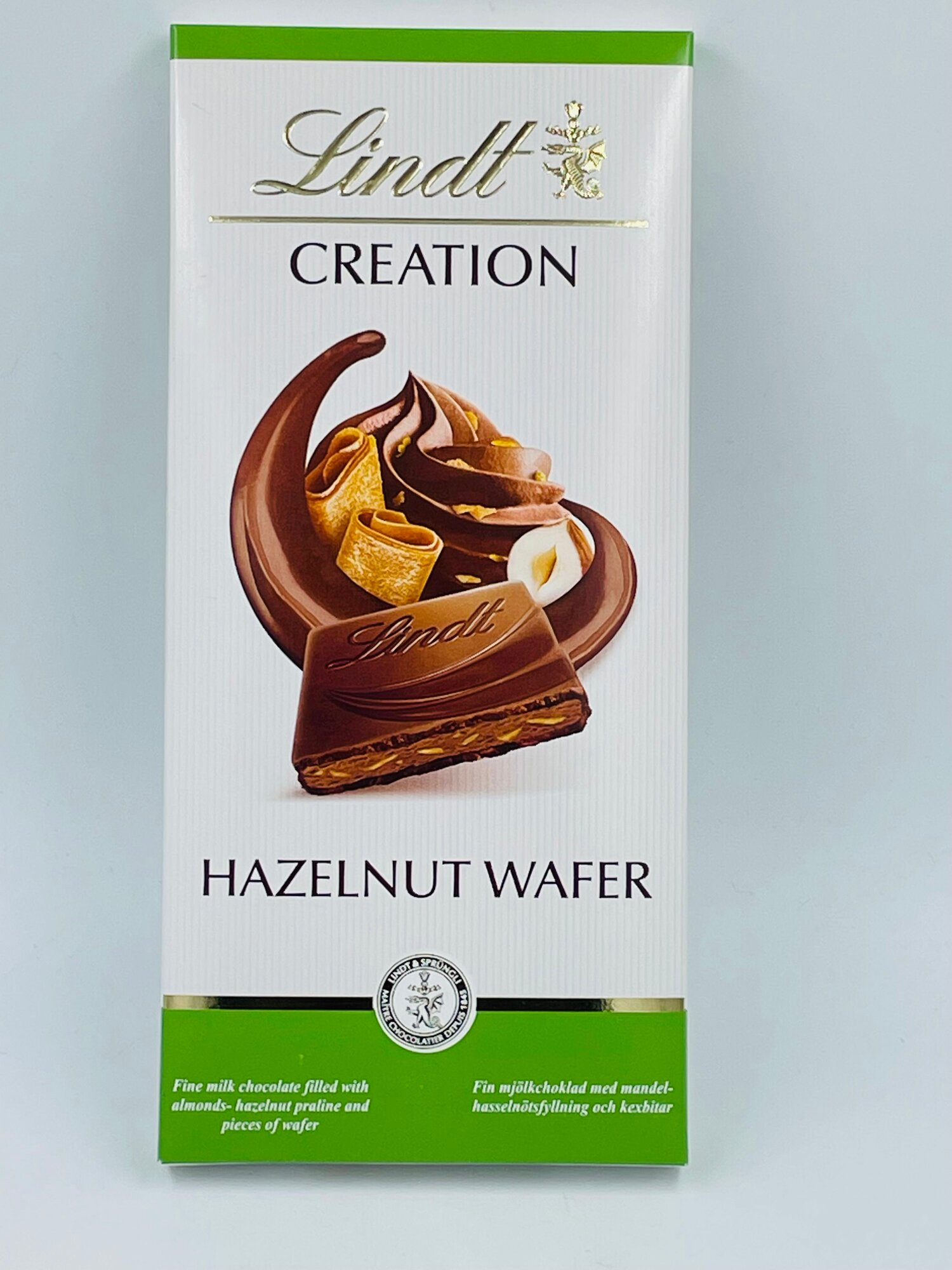 Шоколад молочный Lindt CREATION миндально-ореховое пралине с кусочками вафли,150 г (Из Финляндии)