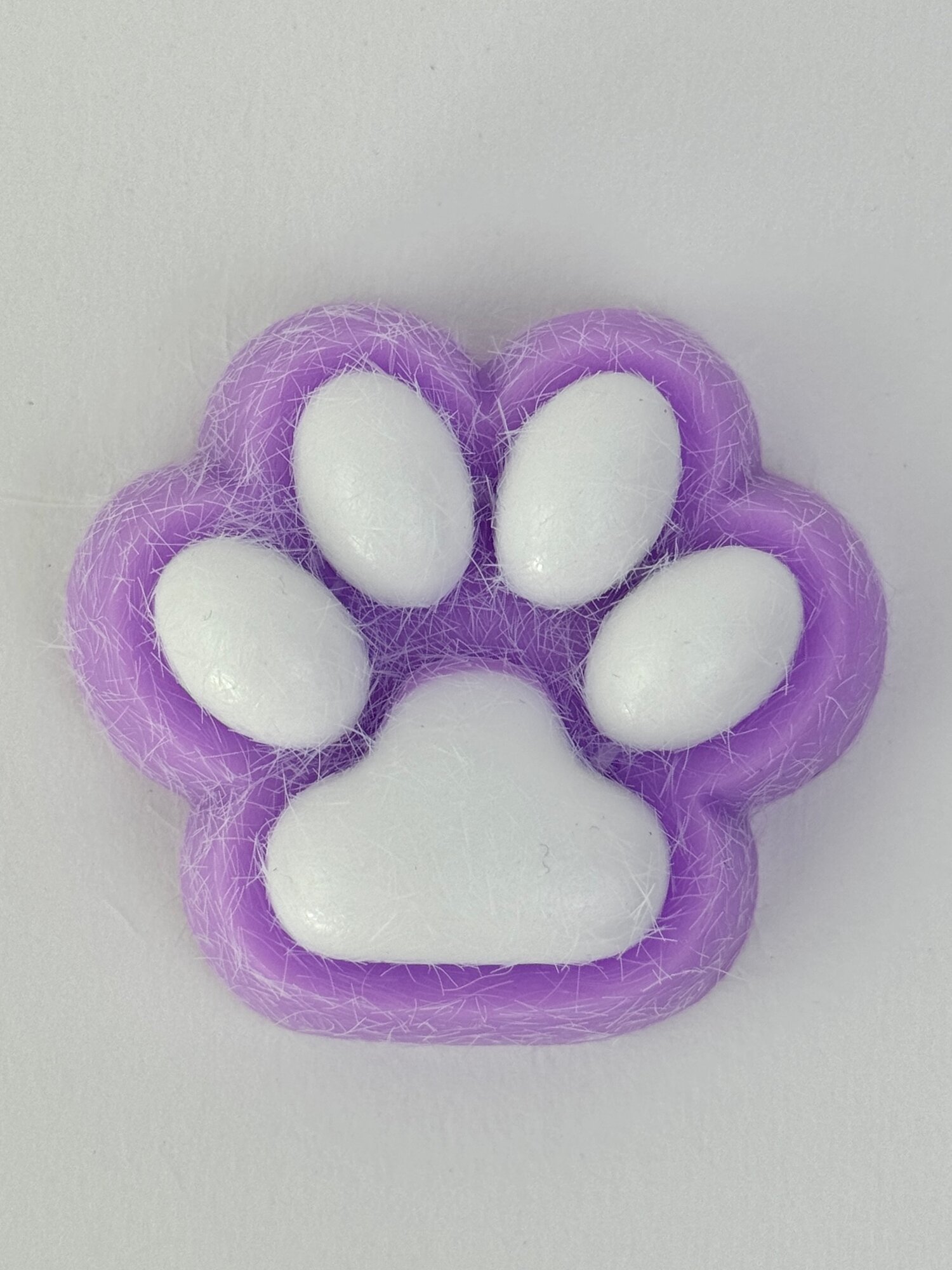 Игрушка антистресс сквиш лапка котика сиреневая