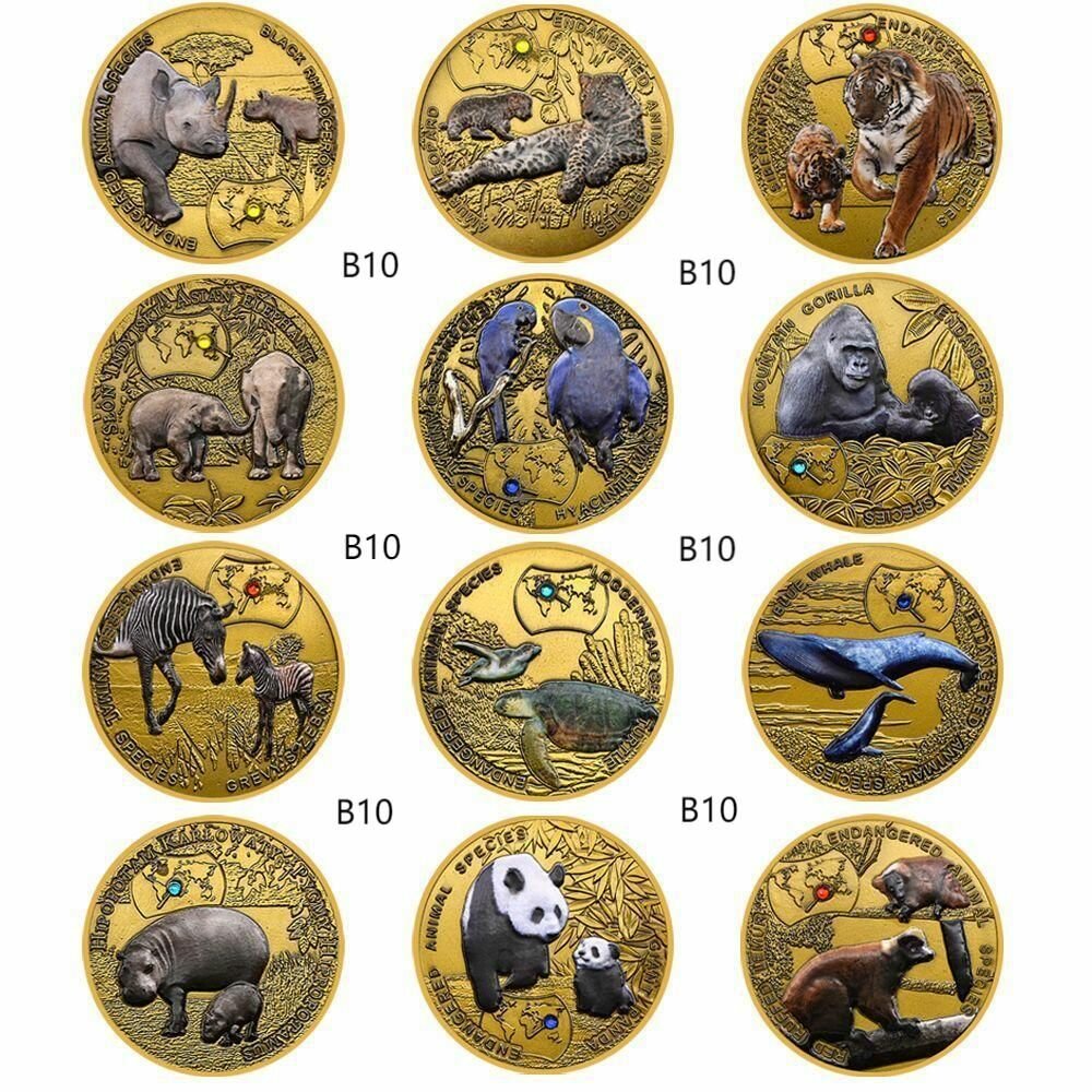 Замбийская памятная монета, посвященная исчезающим видам животных, набор из 12 коллекционных монет, золотого цвета.