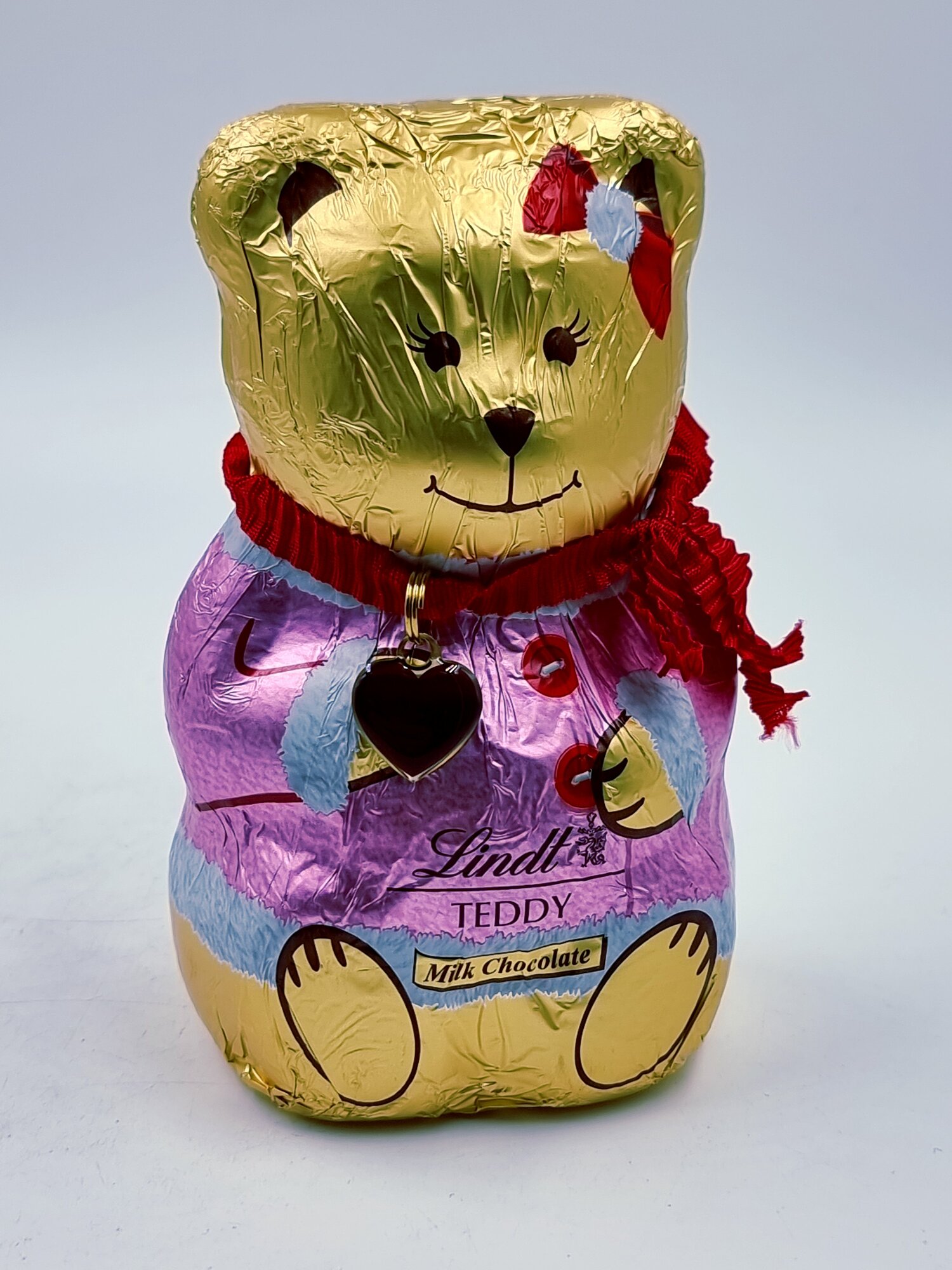 Шоколад молочный мишка Lindt Teddy розовый / красный 100 г 1 шт (Германия)