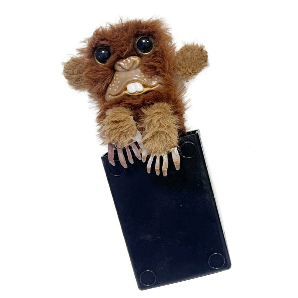 Страшная игрушка-обезьяна в коробке, Торчащие зубы