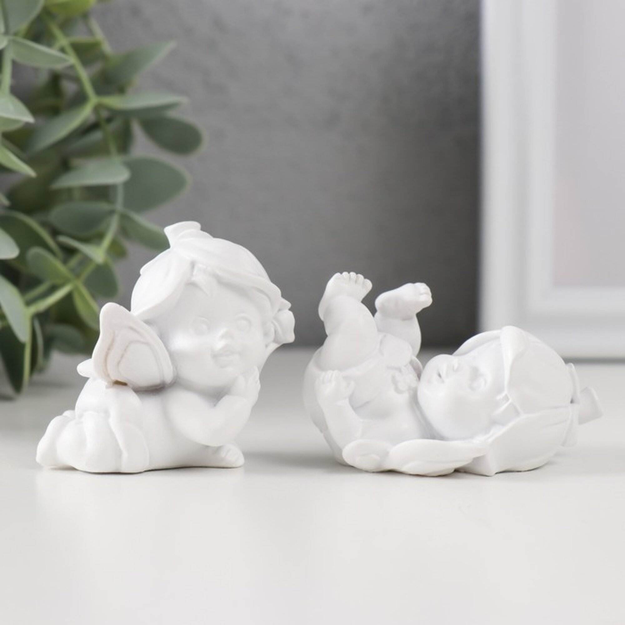 Сувенир полистоун "Малыш-ангел в шапочке из цветка" микс 5х4,5х5 см