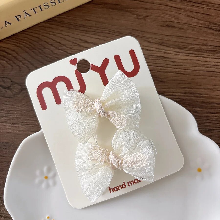 Детские кружевные бантики beige