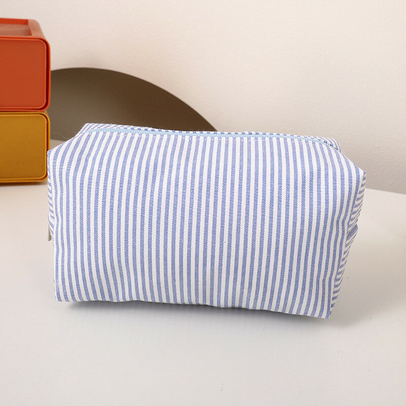 Stylish geometric triangle stationery pouch with striped material for students and office, blue