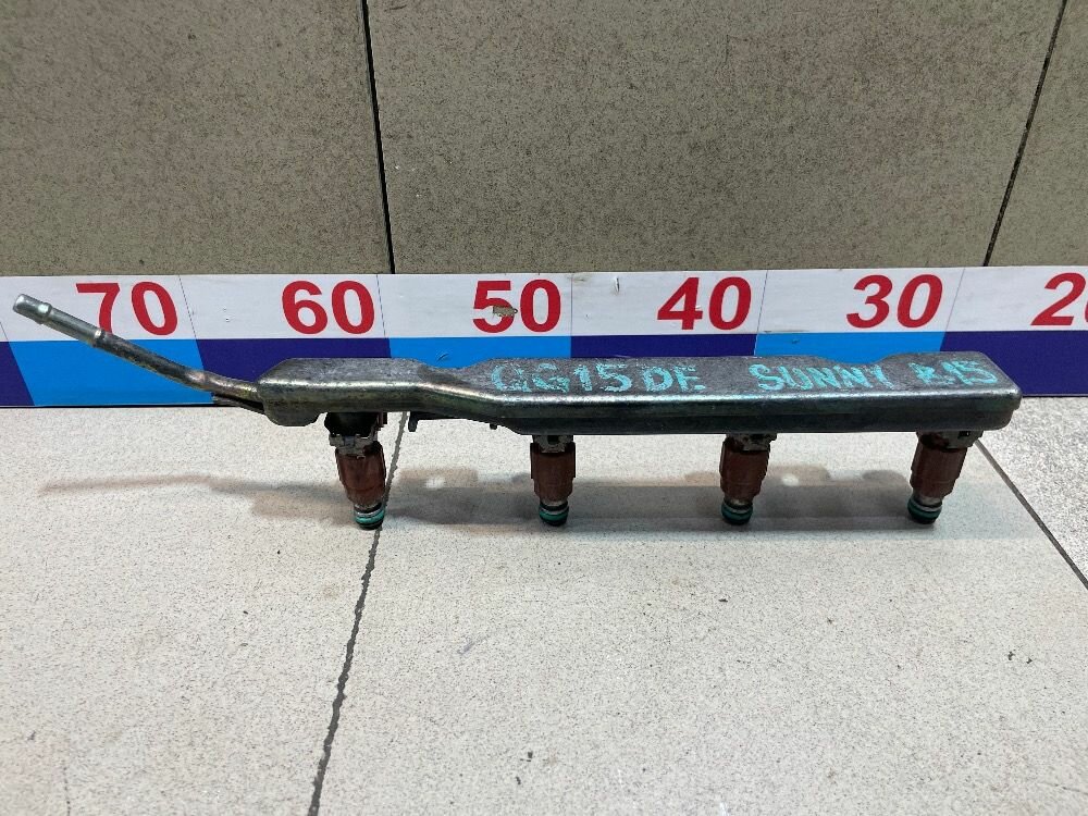 Форсунка топливная Nissan Sunny B15 166005L300