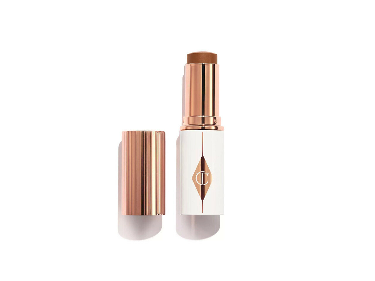 Тональный крем-стик Charlotte Tilbury Unreal Skin Sheer Glow Tint, 14 Deep