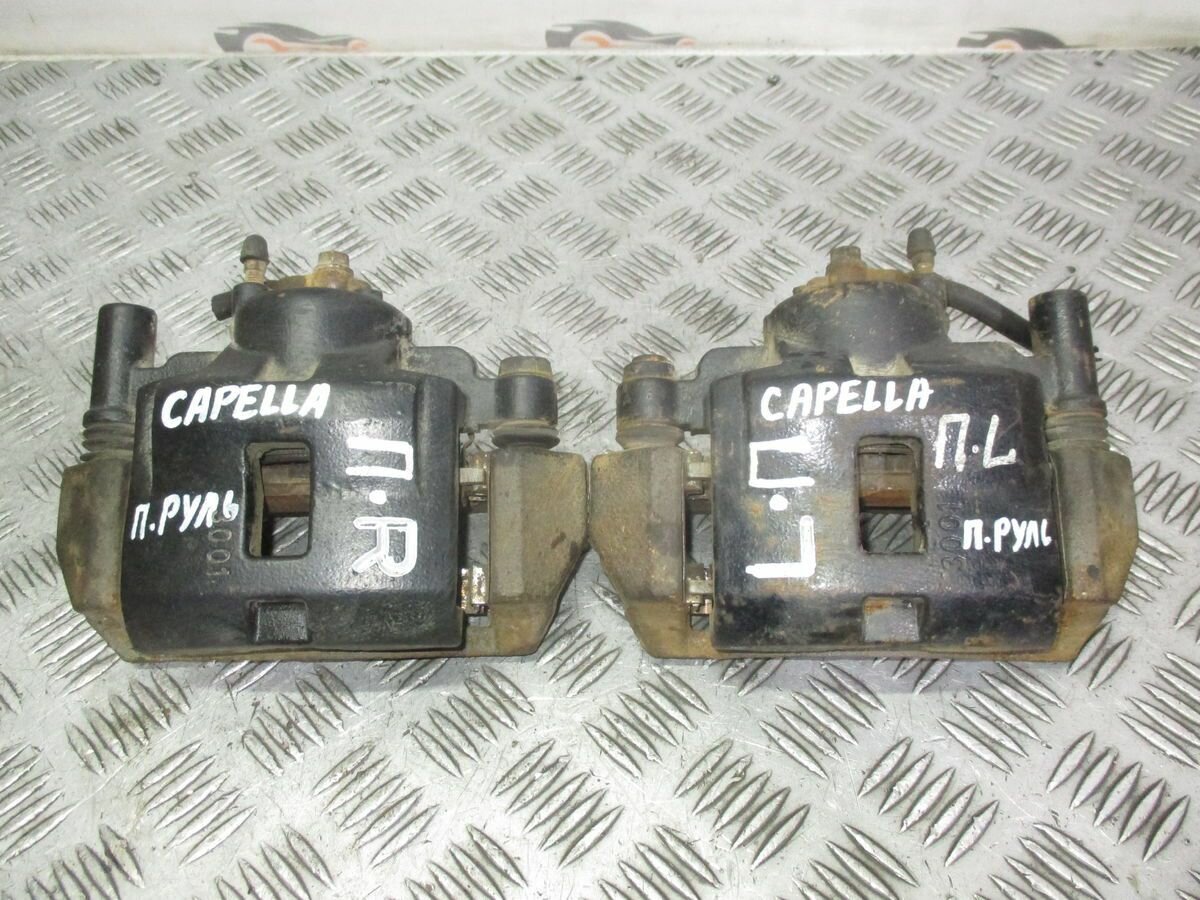 Суппорт тормозной передний Mazda Capella GF 2.0