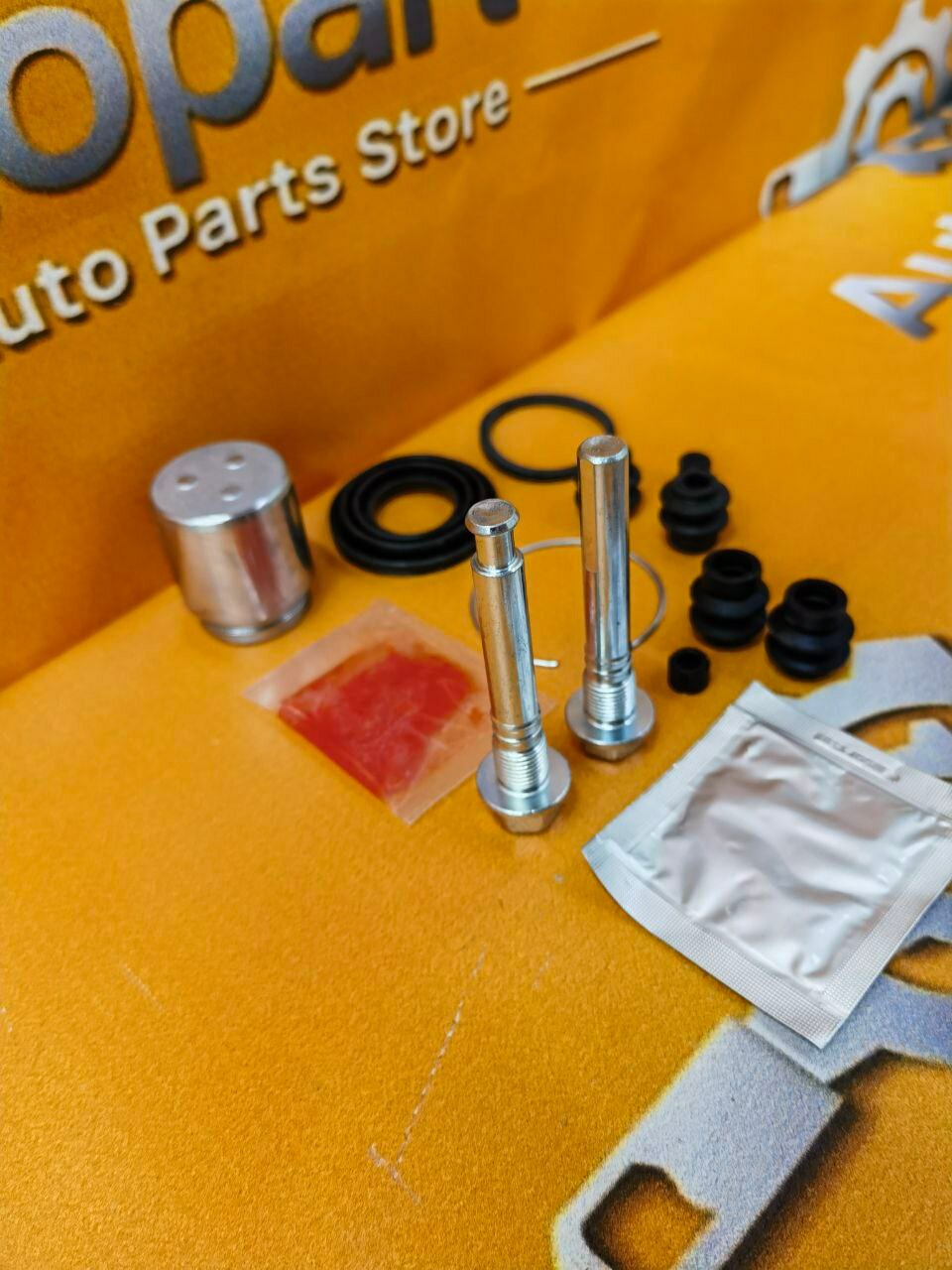 Ремкомплект заднего суппорта с поршнем и направляющими лансер 9 Mitsubishi Lancer 9