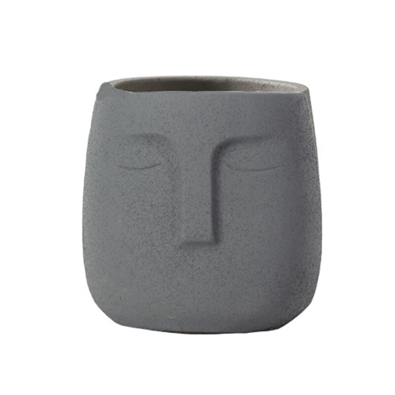 Керамический горшок с лицом Будды