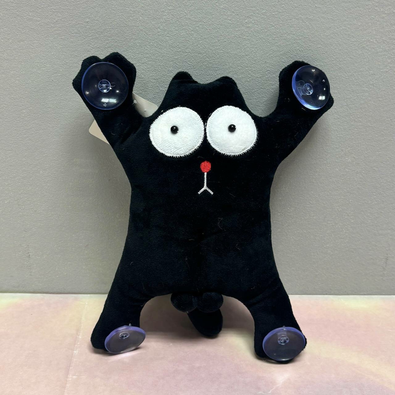 Плюшевая игрушка на присосках "Кот Саймон" черного цвета