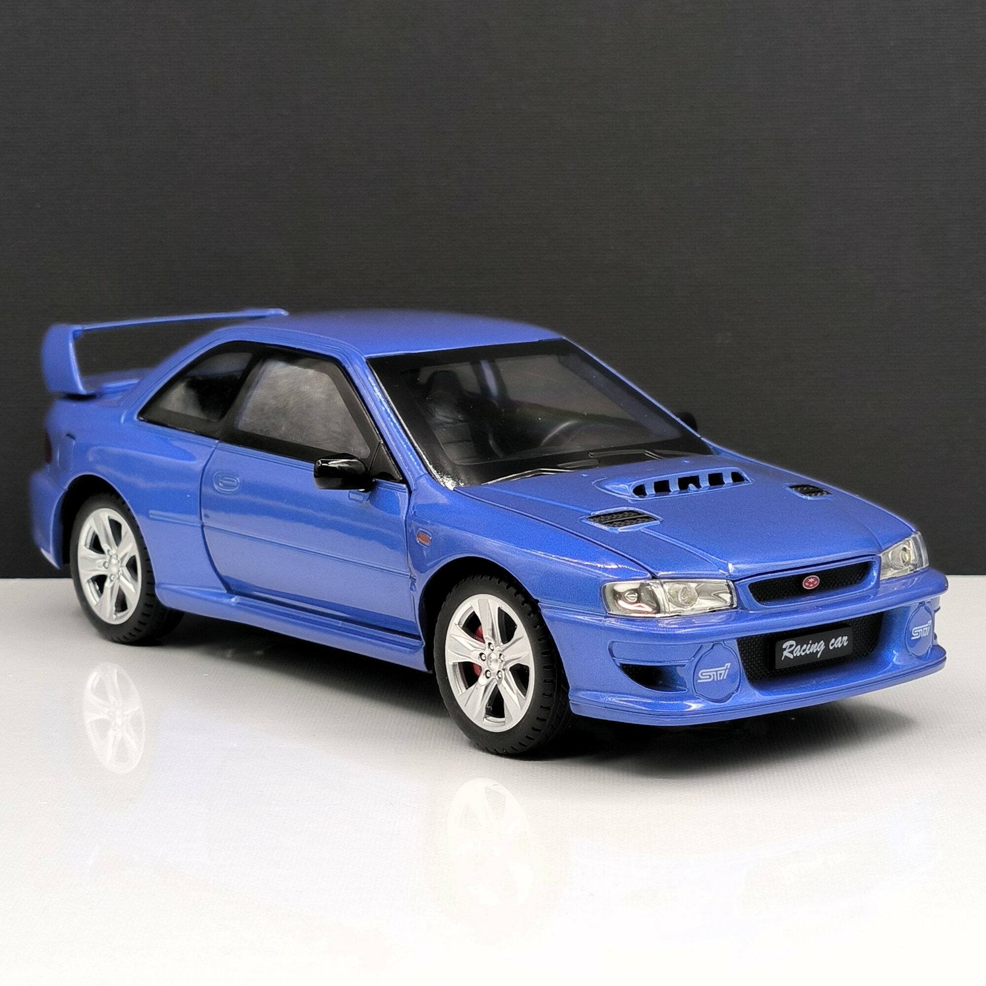 Машинка металлическая Subaru Impreza WRX STI с световым и звуковым сопровождением. Масштаб модели 1:24