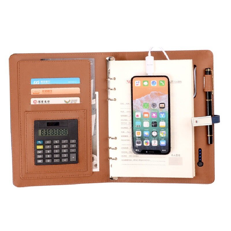 Перезаряжаемый блокнот-пауэрбанк с USB-накопителем, беспроводной зарядкой и сменными блоками, деловой подарок для встреч и презентаций.