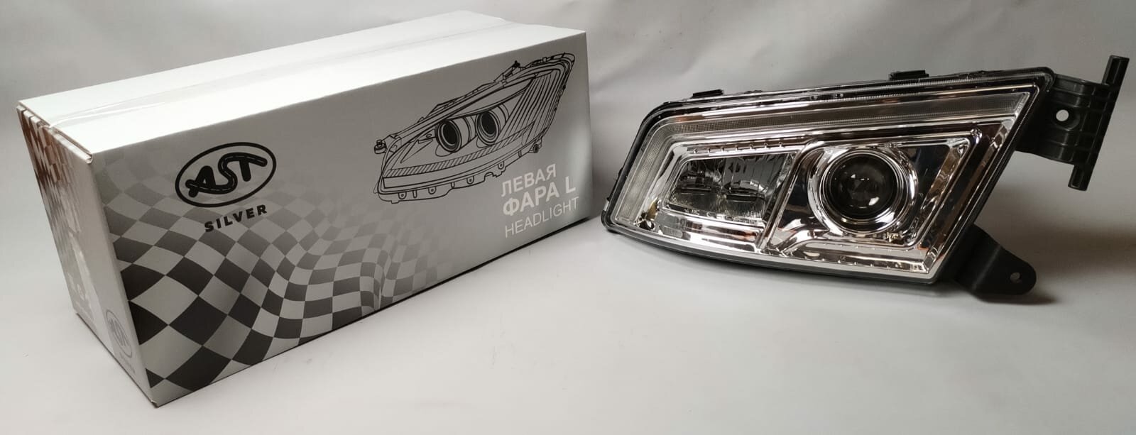 Фара для HOWO C7H/MAN (эл. корректор) левая (AZ962272000010/812W25101-6021) ДХО FULL LED OEM AST Серебро Silver