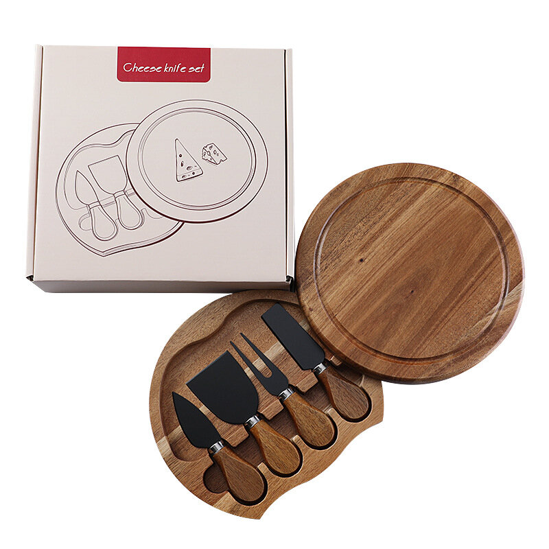 Набор из четырех предметов для нарезки сыра в круглой деревянной коробке из акации.
