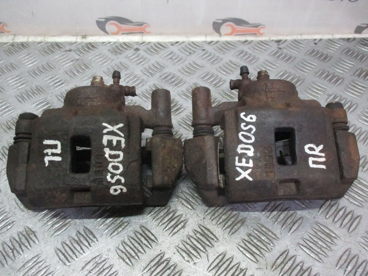 Суппорт тормозной передний Mazda Xedos-6 1992-1999