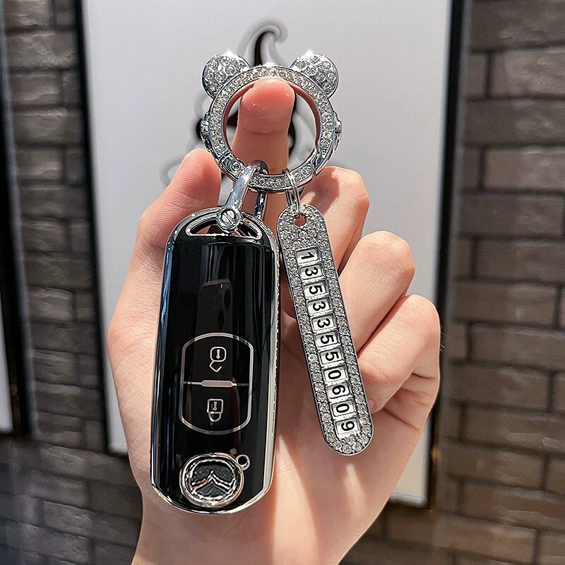 Автомобильный чехол для ключа Mazda Smart 2-кнопочный B-стиль черный корпус с космическим козырьком и серебряной биркой