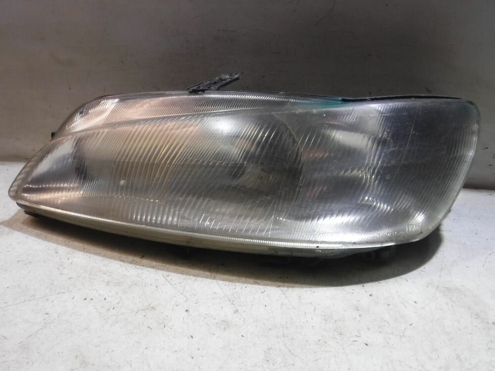 Фара левая Peugeot 306