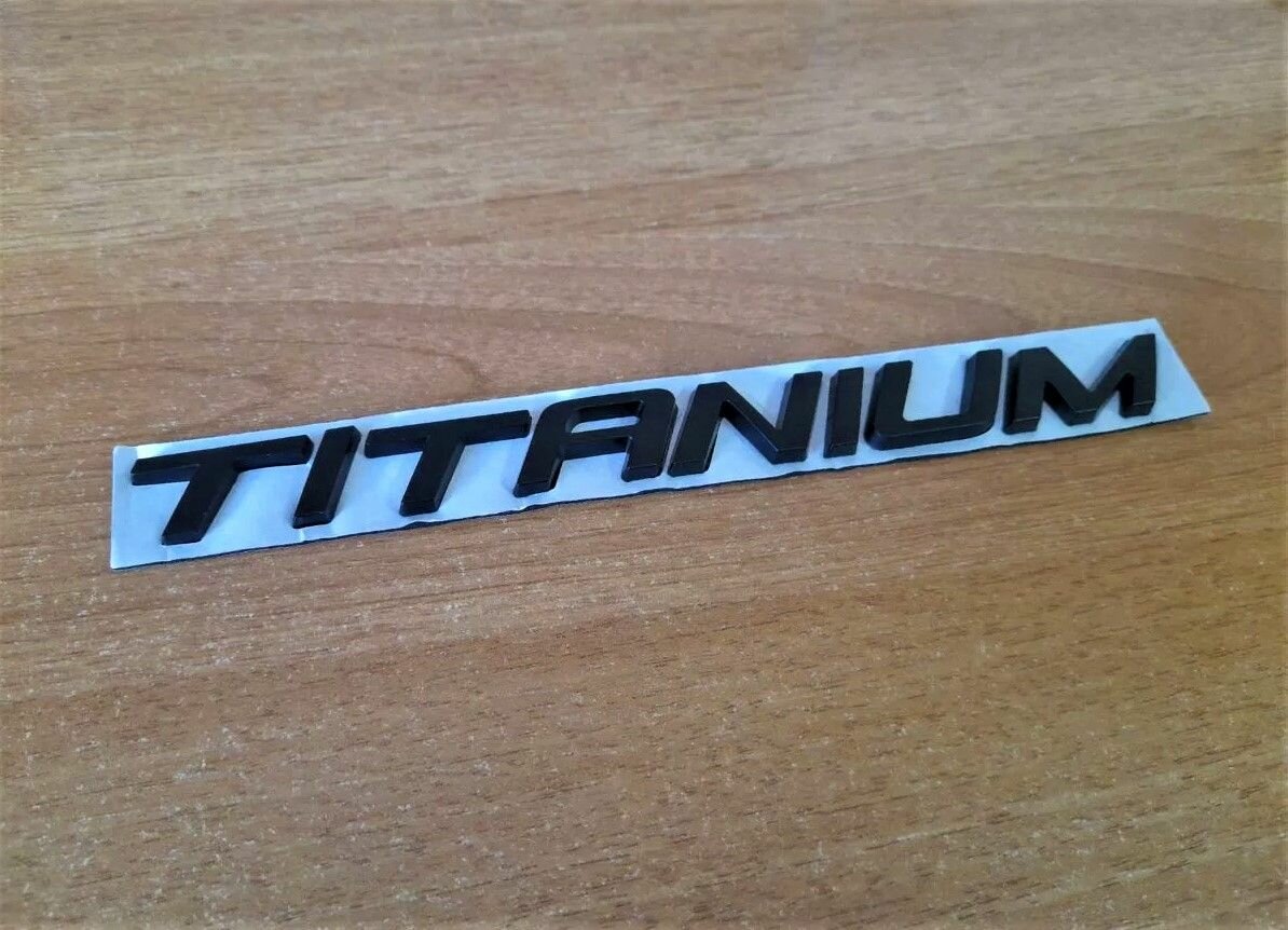 Эмблема буквенная надпись черная TITANIUM на Форд Мондео 4, Форд Мондео 5, Форд Фокус 2, Форд Фокус 3