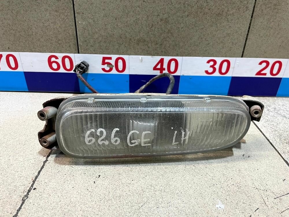 Фара противотуманная левая Mazda 626 GE