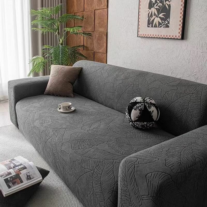 Чехол на диван трехместный с подлокотниками универсальный Joy.Yolife размер дивана 185-230 см, на резинке, с узором листьев 1 шт. Темно-серый