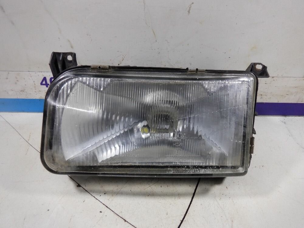 Фара левая VW Passat B3 357941017