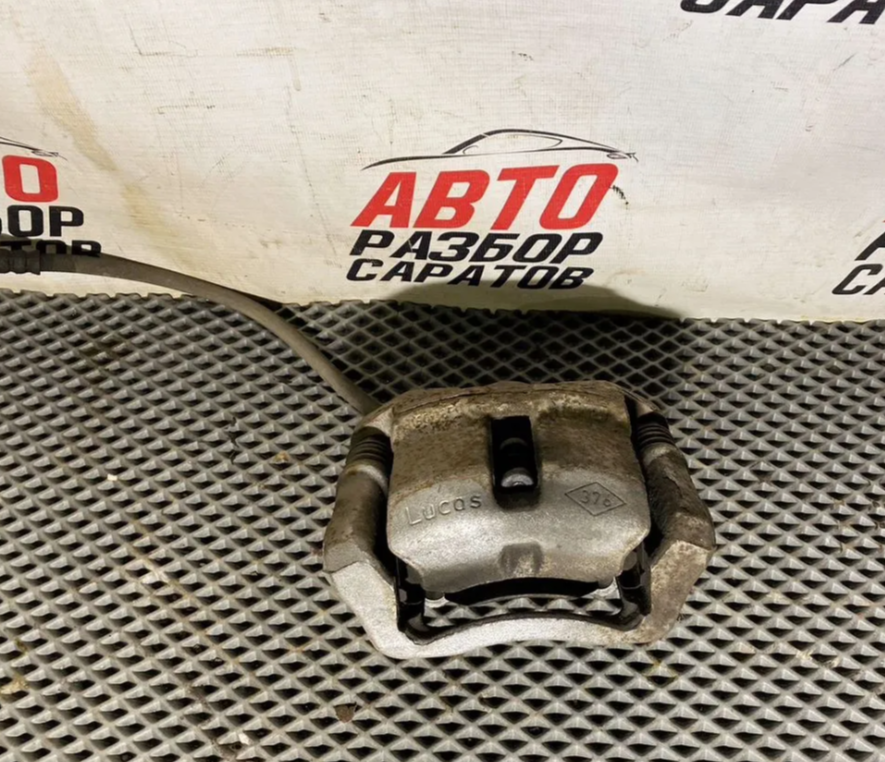 Тормозной суппорт правый Renault Sandero, Logan 7701207959