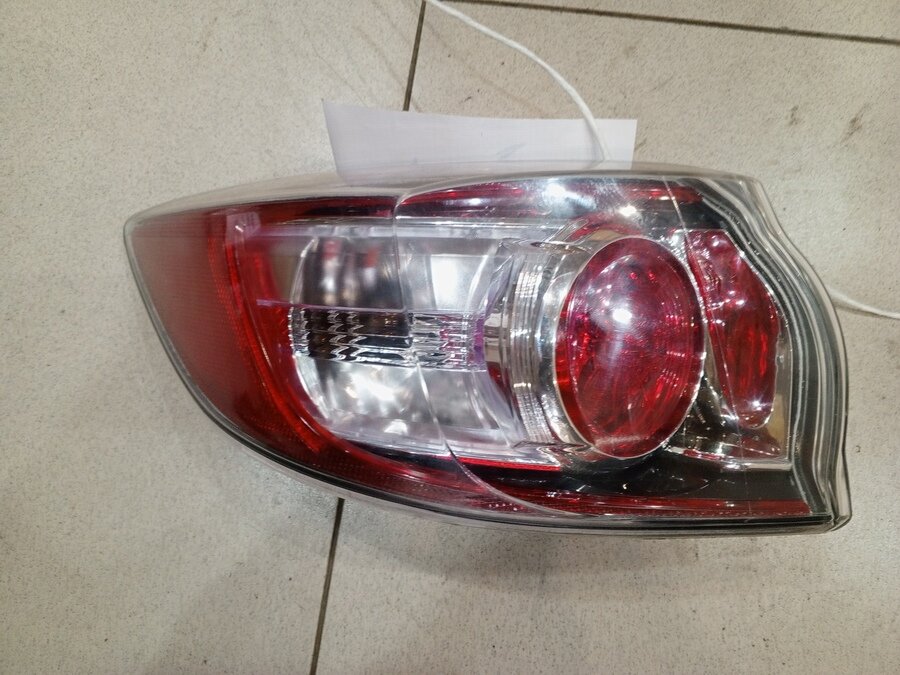 Фонарь задний наружный левый от Mazda 3 BL 2009-2013
