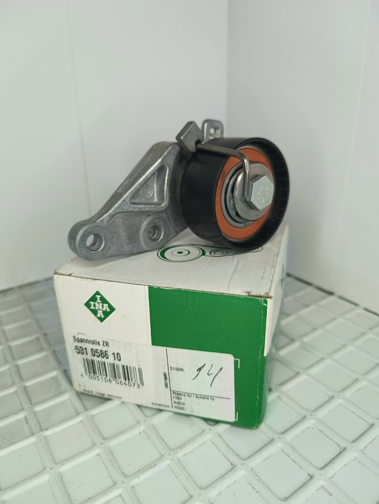 Ролик натяжной ремня ГРМ Ina 531 0586 10 1E10-12-700C 1361840 30750904 FORD MAZDA VOLVO