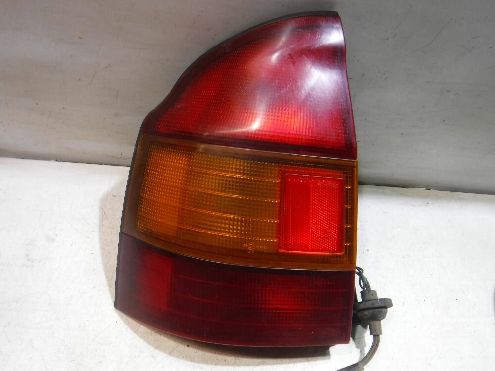 Фонарь задний левый Mazda 323 BA BG3B51180C