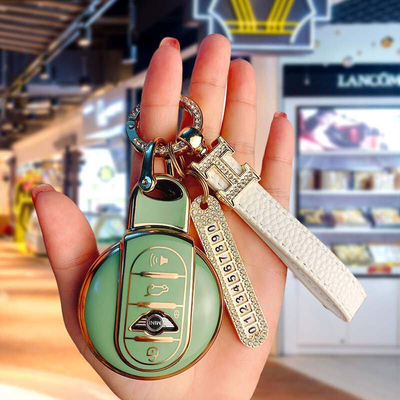 BMW MINI чехол из ТПУ для автомобильных ключей, зеленый с белым шнуром H-формы и золотым номерным брелоком