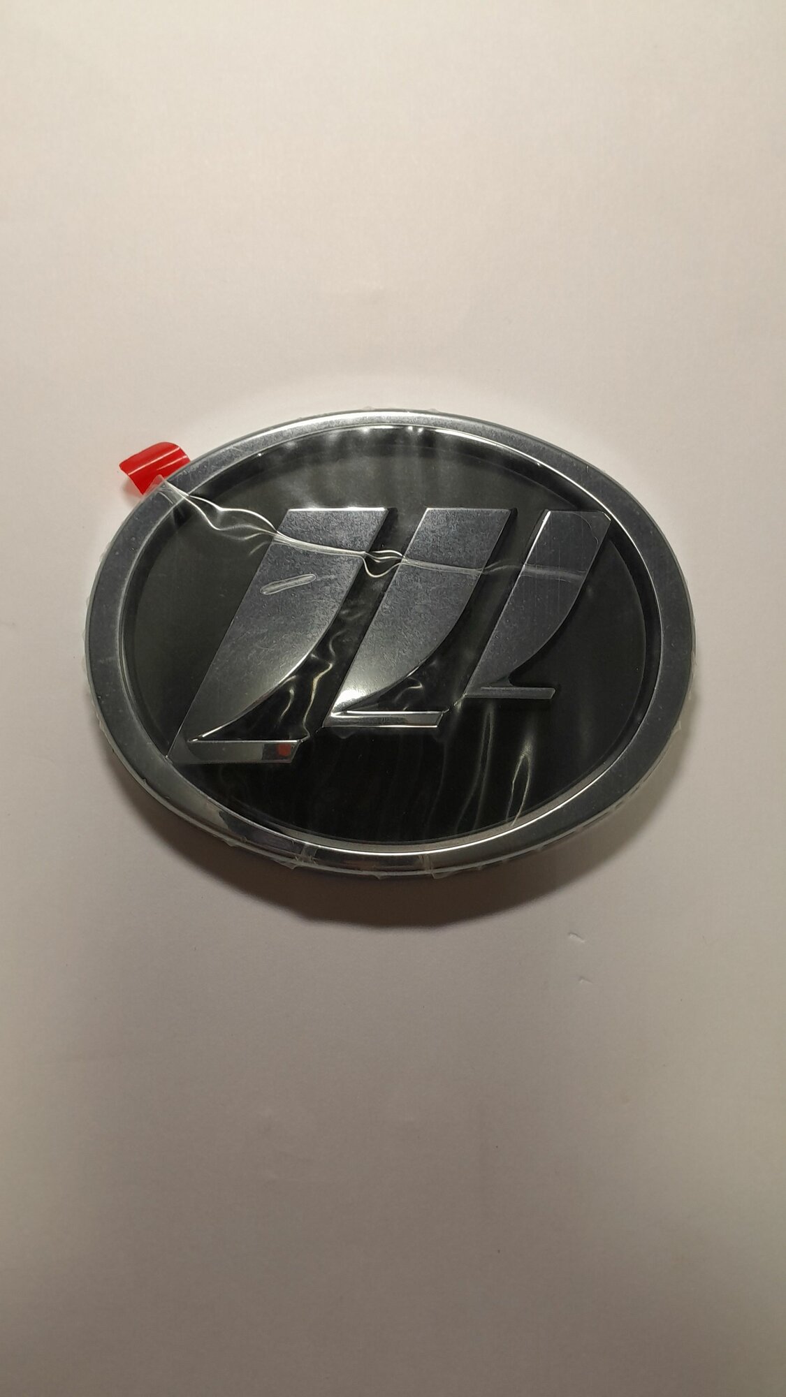 Эмблема крышки багажника оригинал LIFAN OEM-номер L3921012A2 для Lifan Breez ( 520 ) .