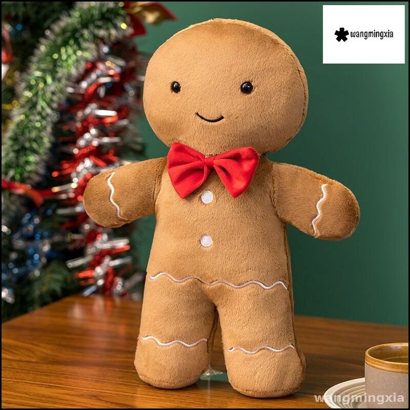Эксклюзивная интерьерная кукла в виде имбирного человечка дополняется рождественскими подушками, пряничным домиком и игрушкамимедузами для елки
